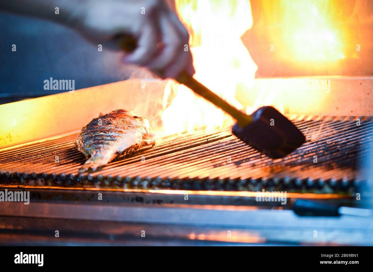 grilled fish with salt & pepper Stock Photo - Alamy