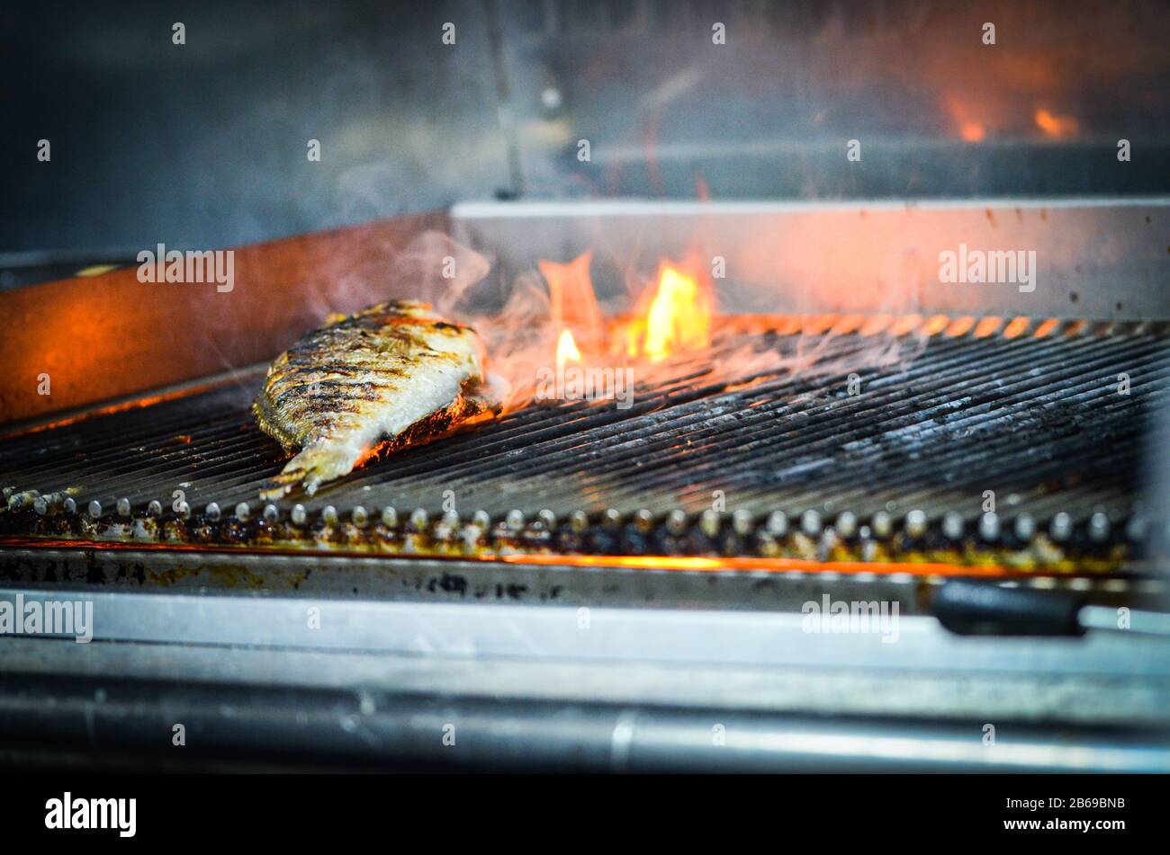 grilled fish with salt & pepper Stock Photo - Alamy