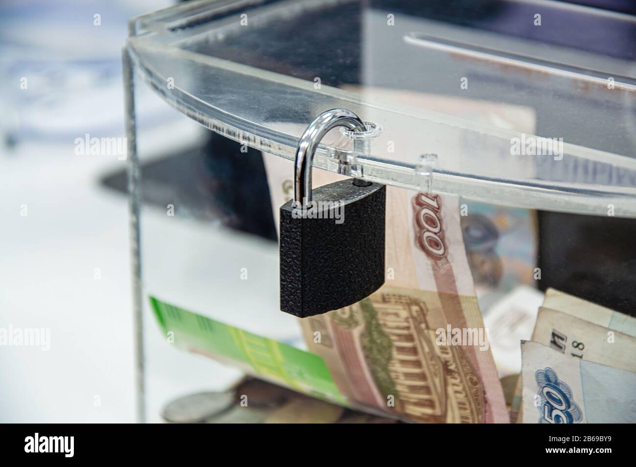 Russian rubles are close-up in a plastic box under lock and key ...