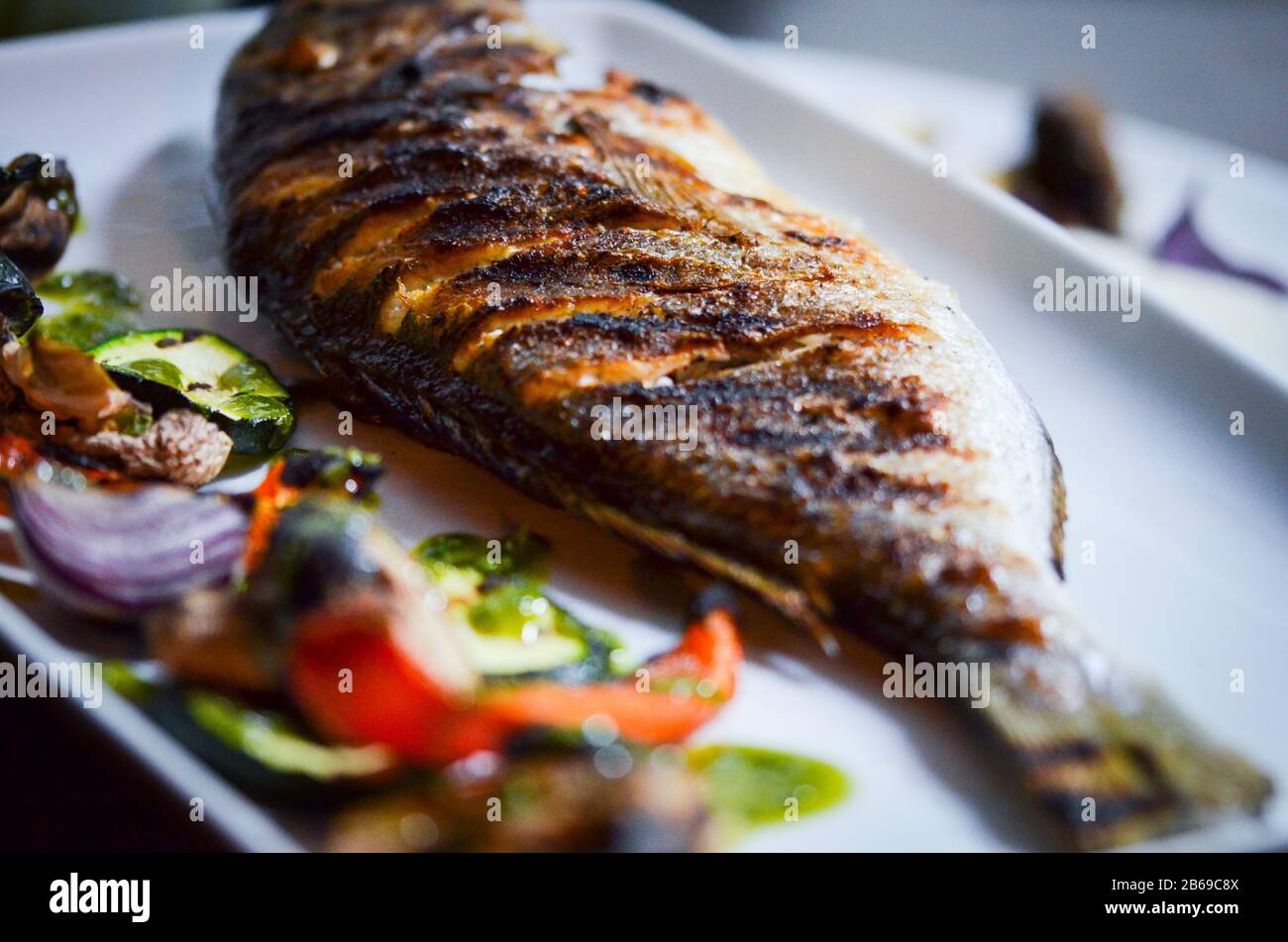 grilled fish with salt & pepper Stock Photo - Alamy