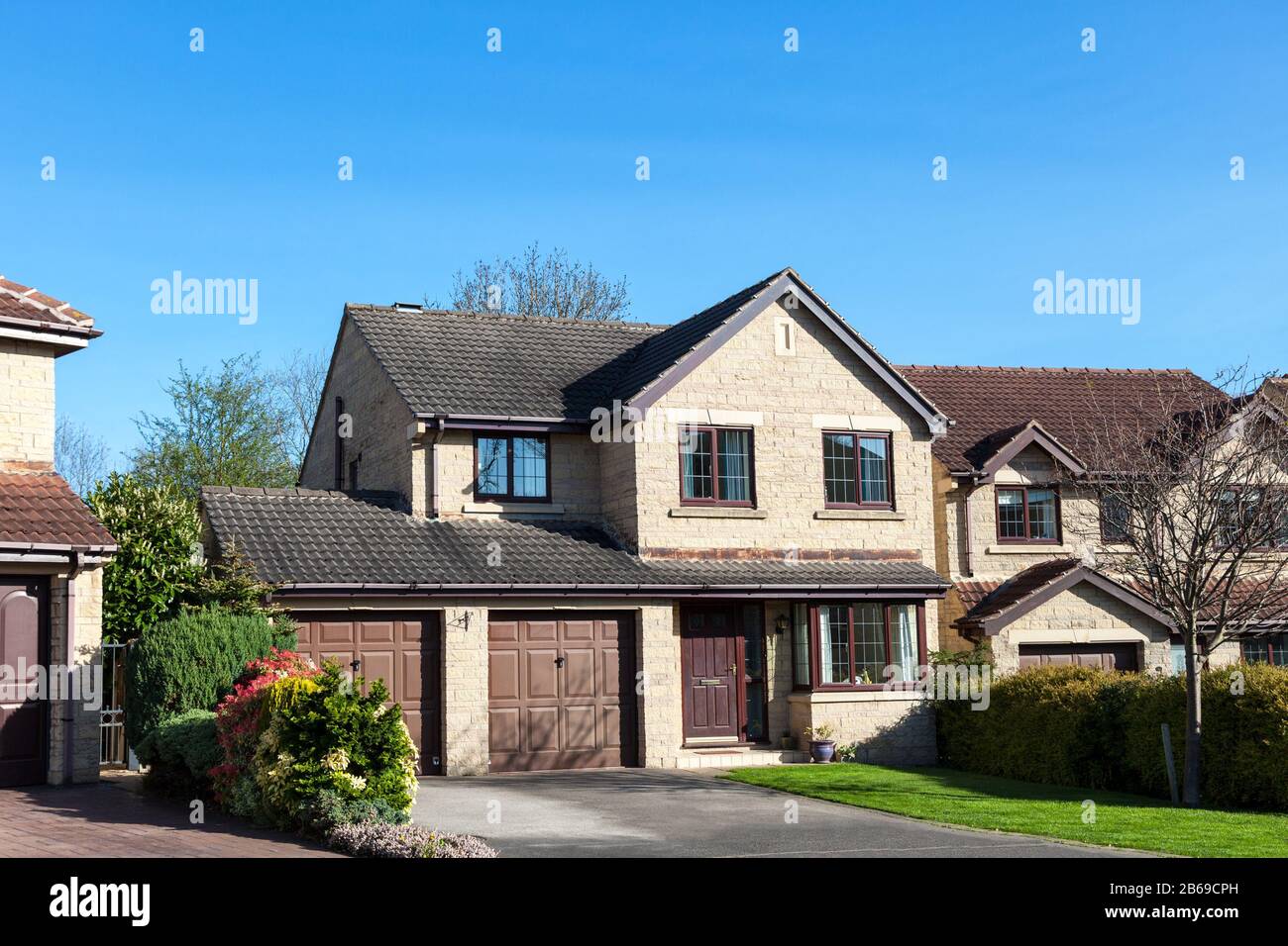 Elegant english detached house with double garage Stock Photo - Alamy