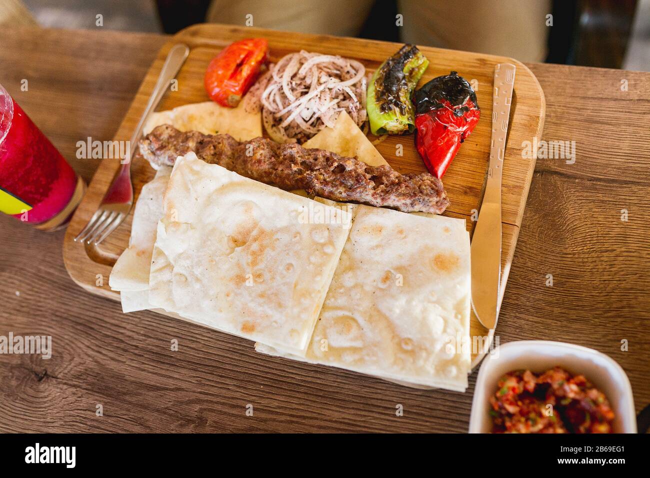 Traditional Oriental kebab dish on a plate in cafe, candid photo Stock ...