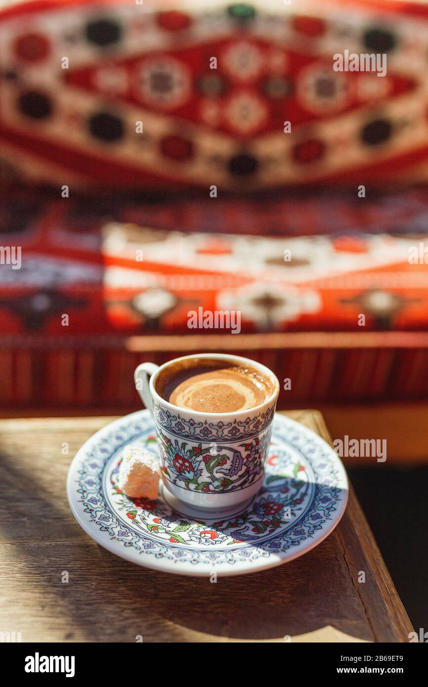 Authentic traditional Turkish coffee in a mug with national patterns on ...
