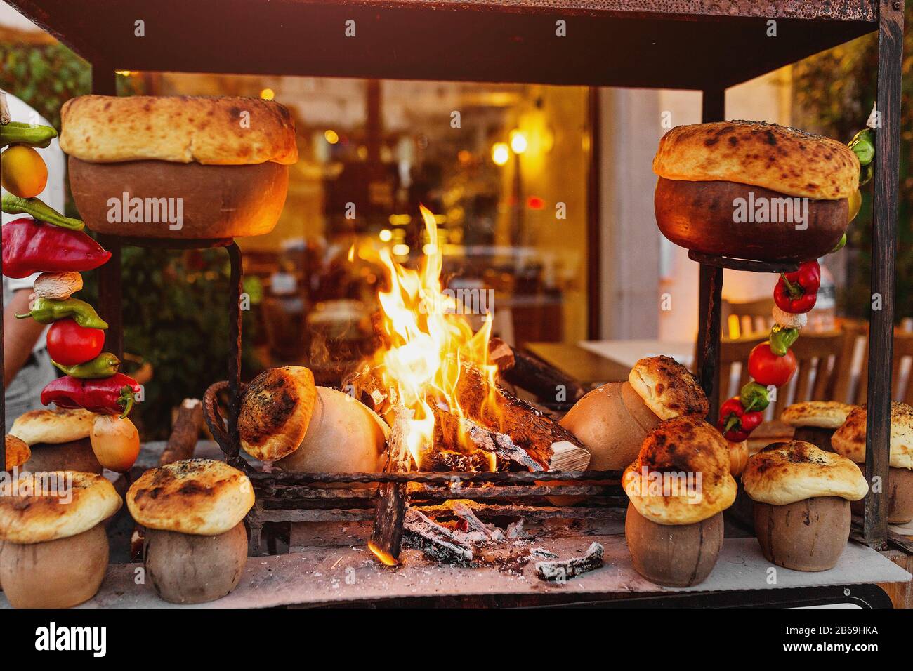 traditional Turkish Testi Kebab cooked in clay pot on open fire at ...