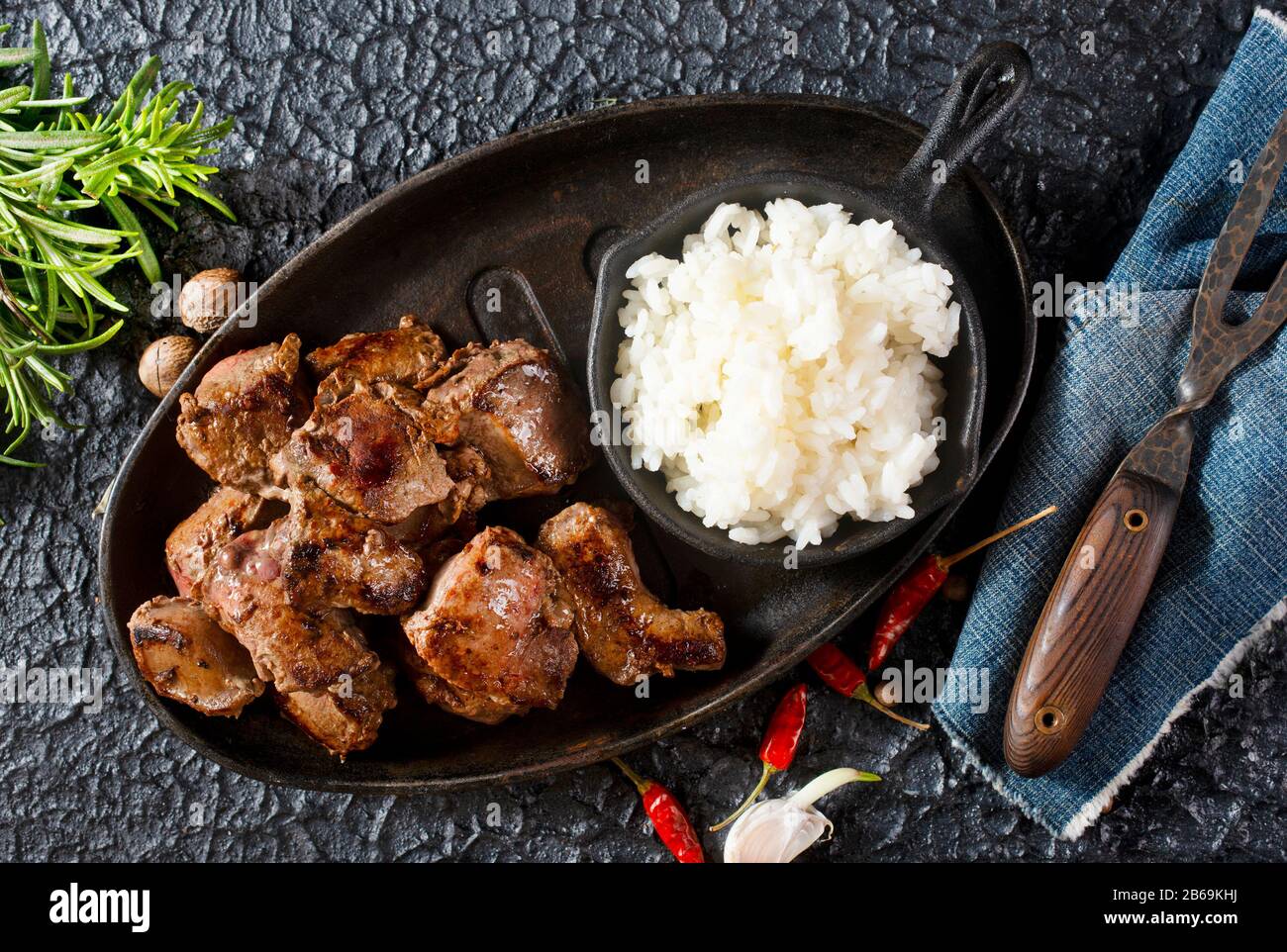 fried liver with boiled white rice on plate Stock Photo - Alamy