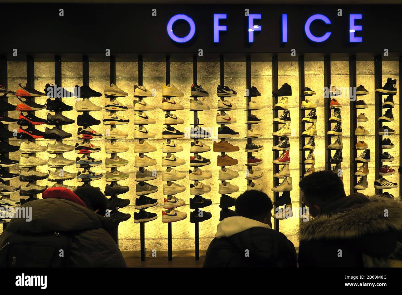 3 young black men choosing trainers Stock Photo - Alamy