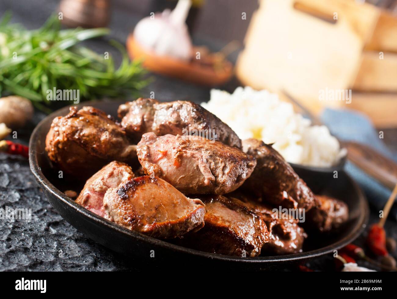 fried liver with boiled white rice on plate Stock Photo - Alamy