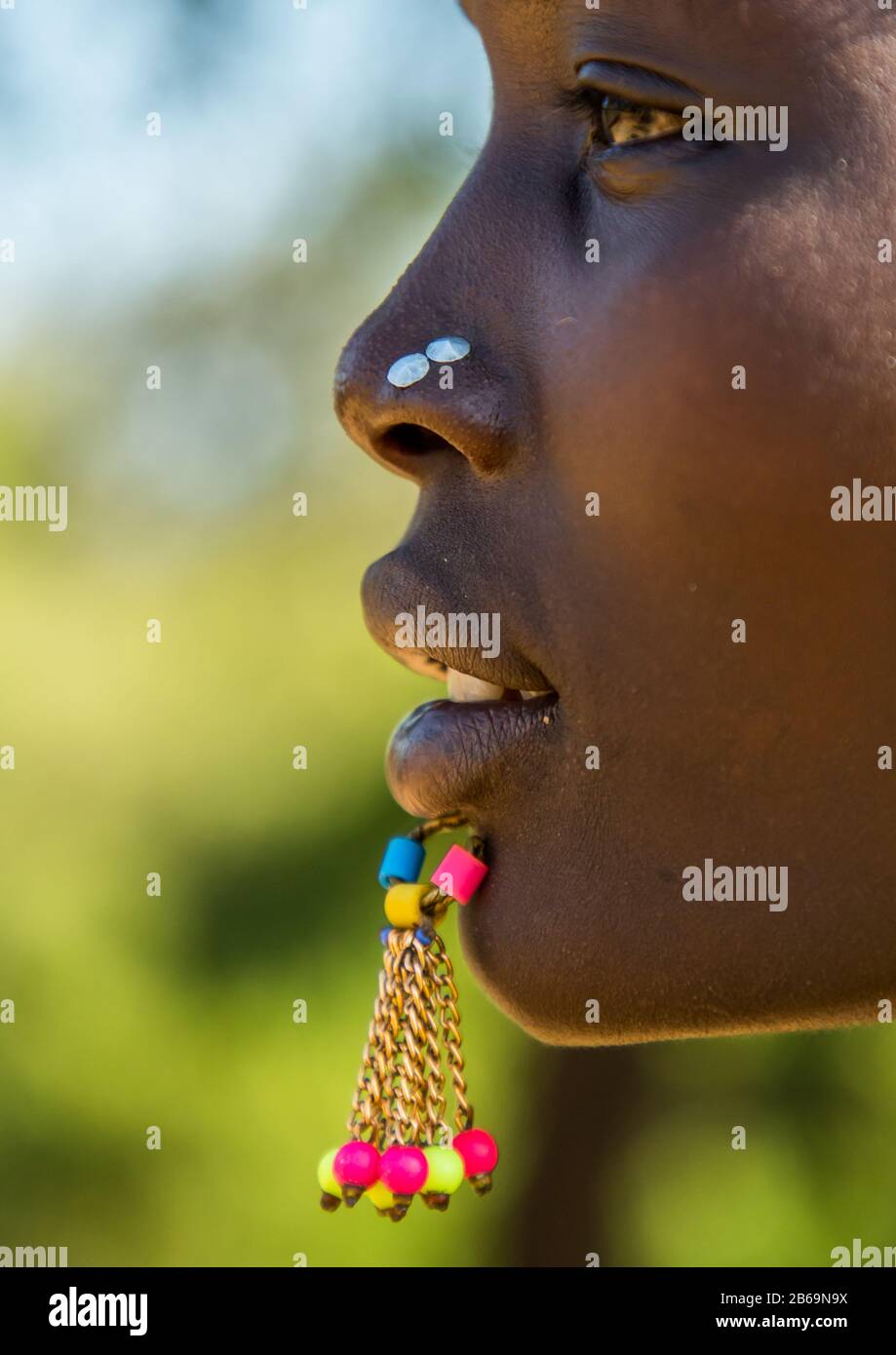Close up of the face of a Larim tribe woman with a chin labret, Boya ...