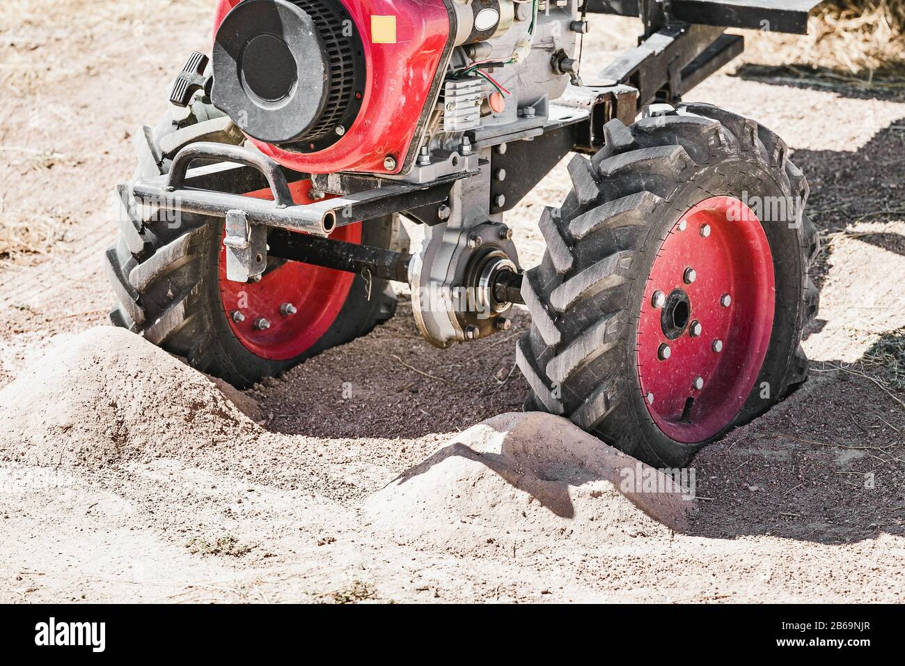 The small handy farm machine motor plow closeup standing in deserted ...