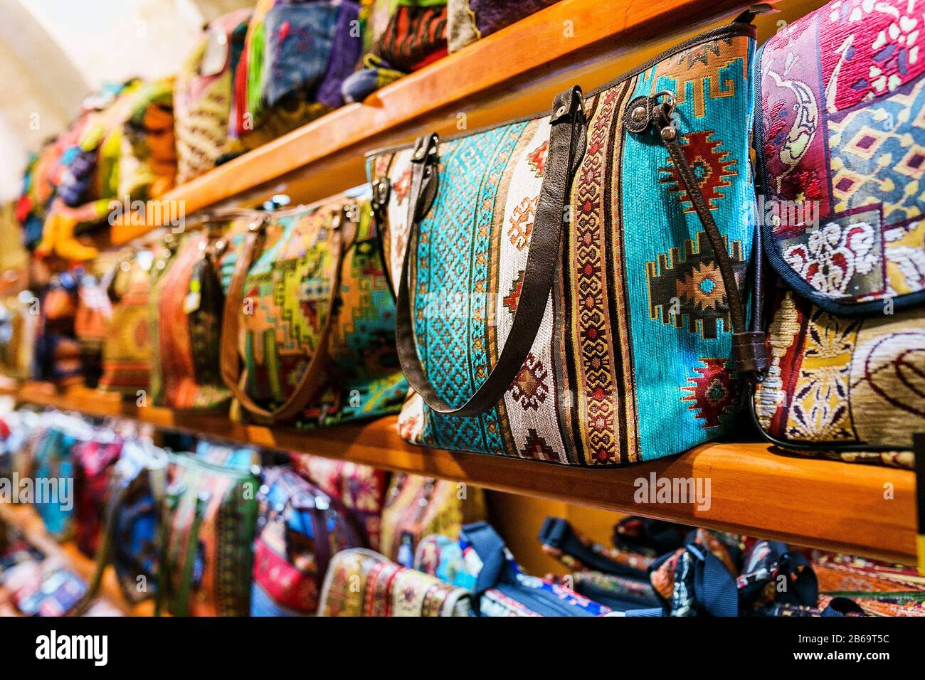 Colorful hand bag collection in shop with ethnic ornament Stock Photo ...