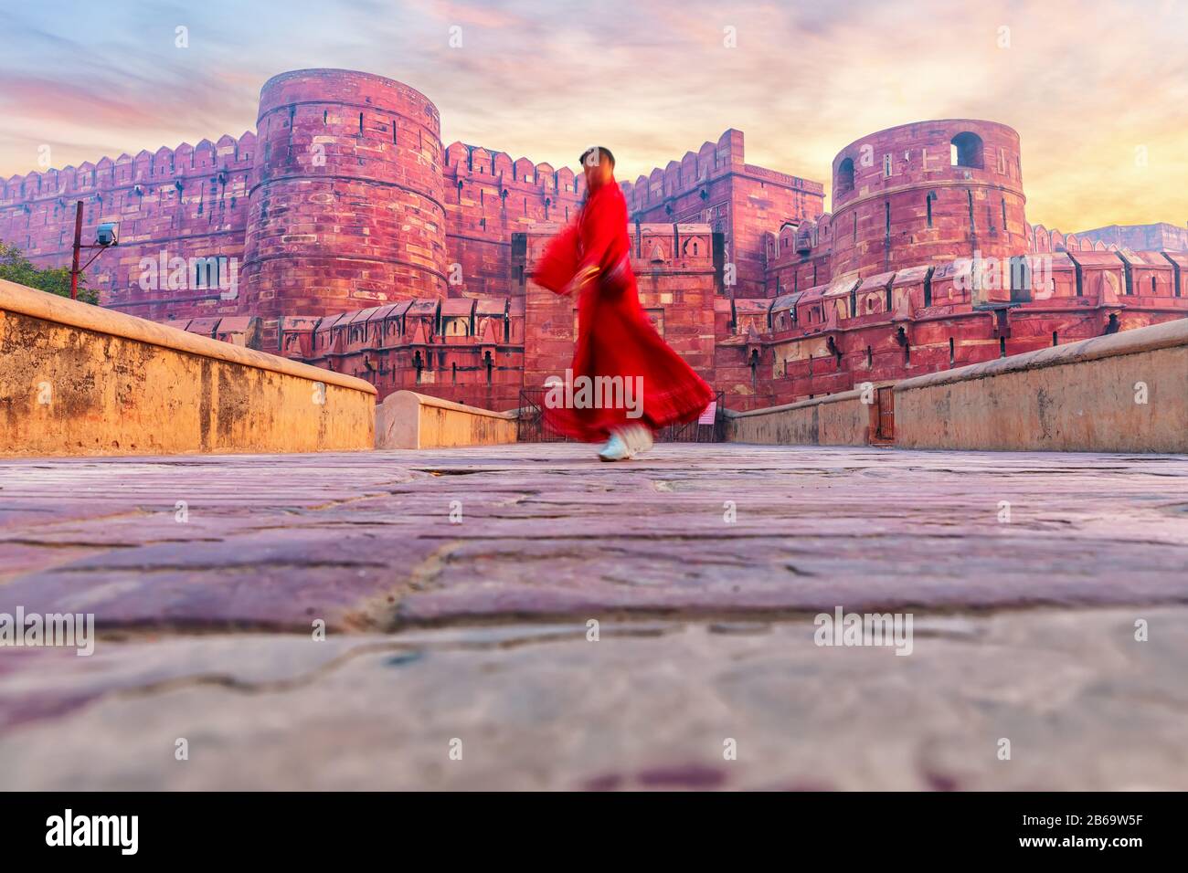 Agra Fort and an Indian woman silhouette Stock Photo - Alamy