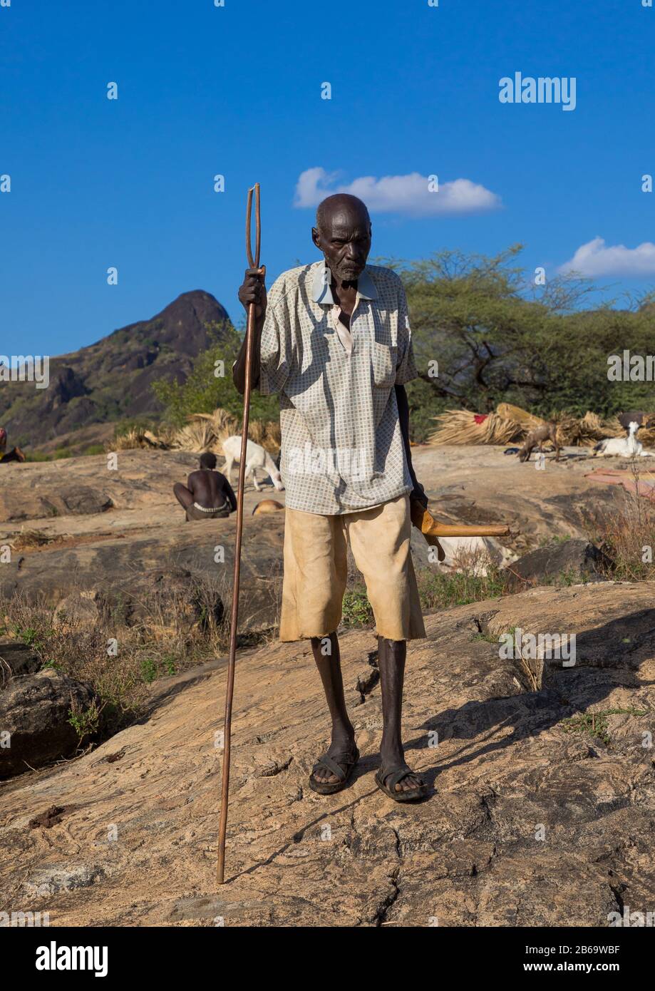 African man with walking stick hi-res stock photography and images - Alamy