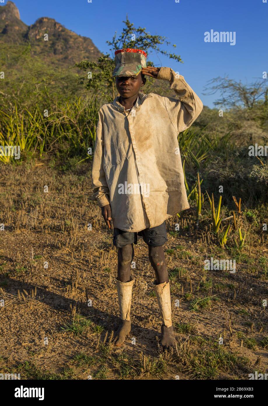 Portrait of a Larim tribe boy saluting with the hand, Boya Mountains ...