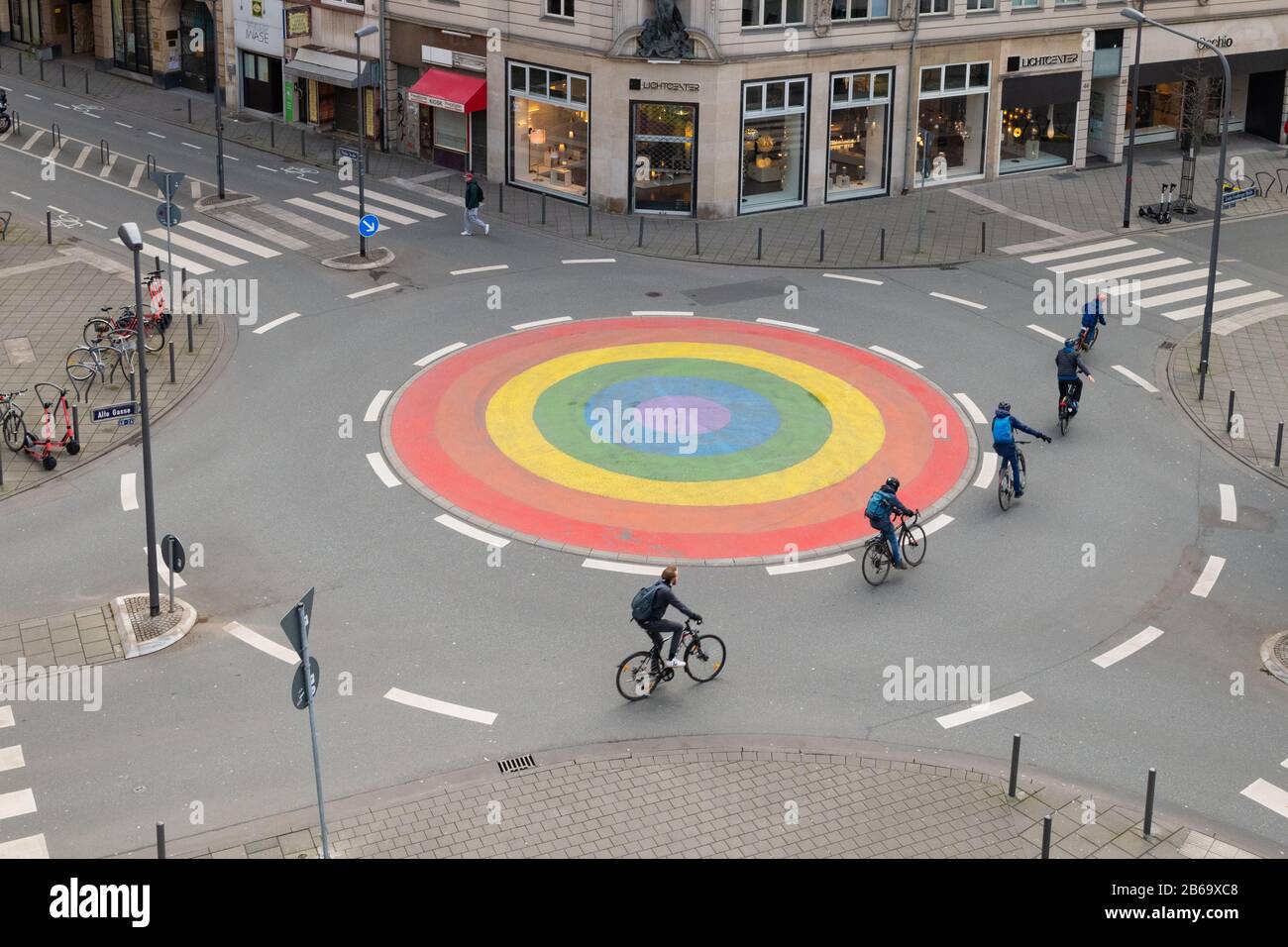 cyclists cycling round a rainbow roundabout, Frankfurt, Germany Stock ...