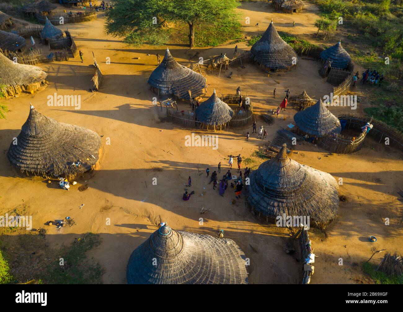 Aerial view of a Larim tribe village with Thatched roofs houses, Boya ...