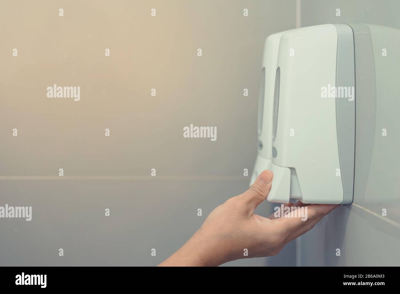 Close up to Hands of woman pumping soap with liquid soap press in the ...