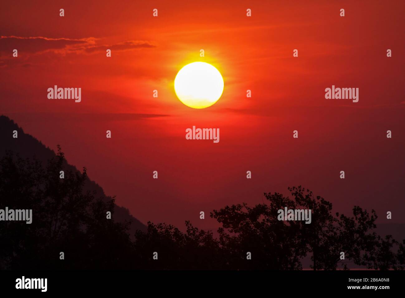 Sun disk on the background of the red sky during sunset Stock Photo - Alamy