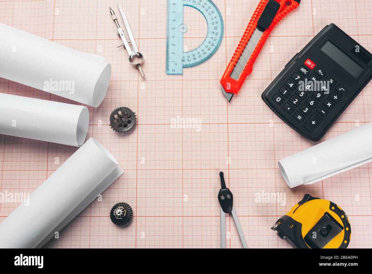 drawing tools on red graph paper with copy space Stock Photo - Alamy