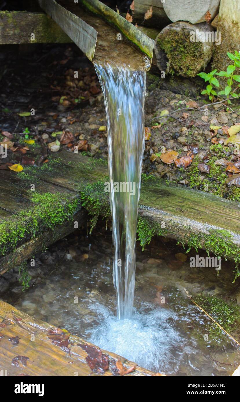 Running clear water to troughs Stock Photo - Alamy