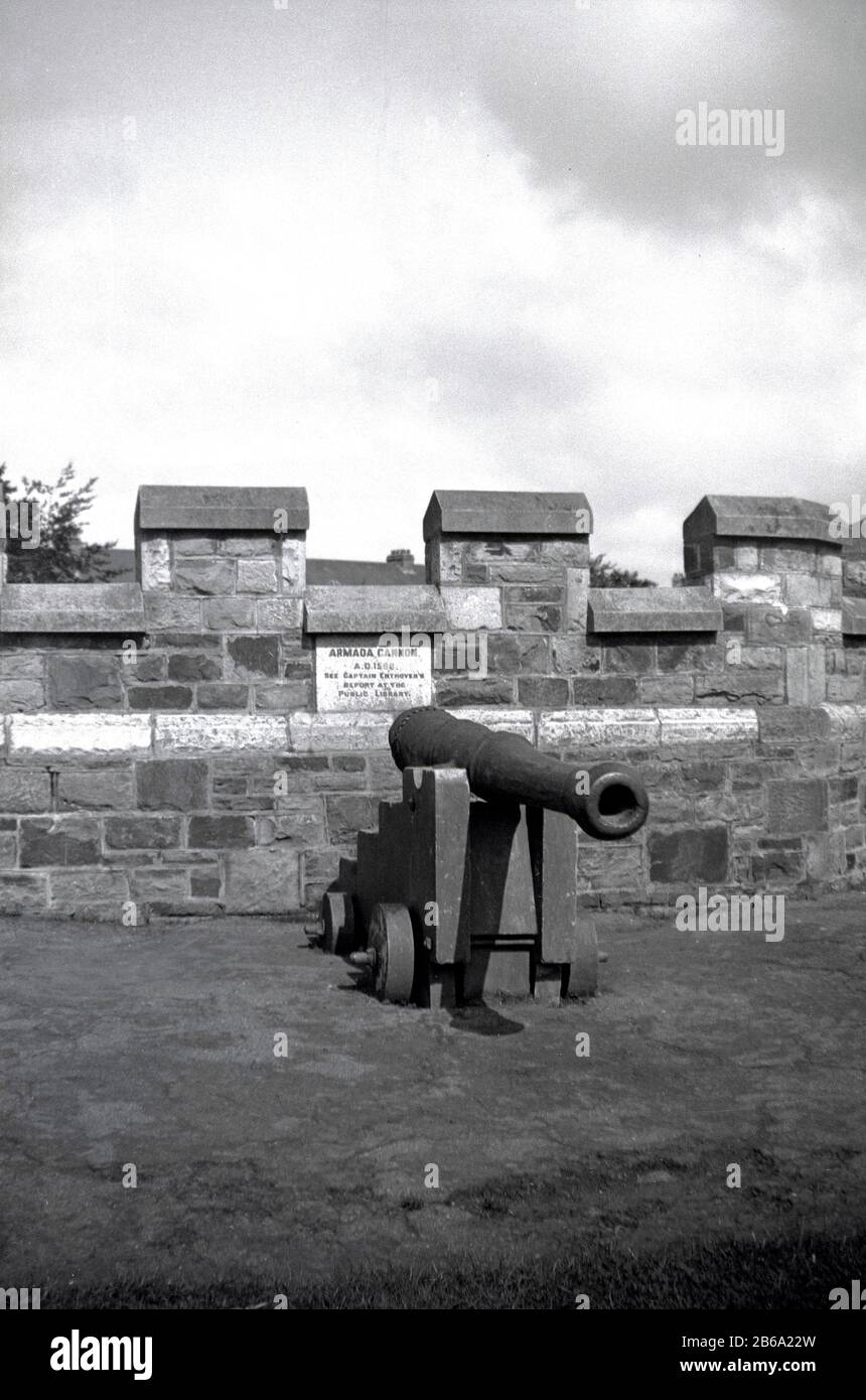 1950s, historical, Outside castle walls, an Armada Cannon dating from A ...