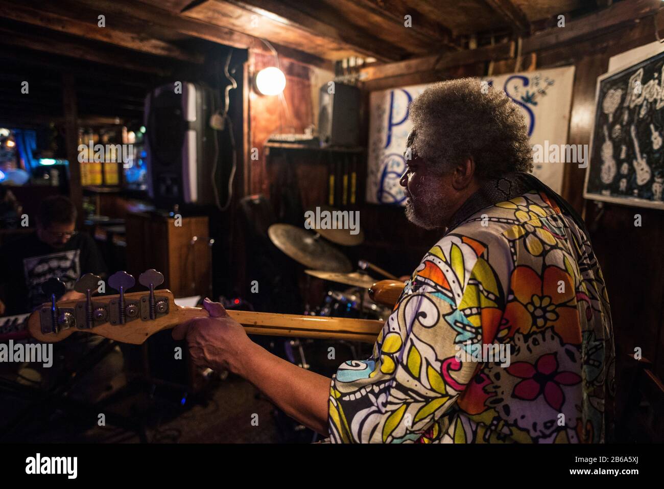New York City, USA - August 2, 2018: Bass guitarist playing with its ...