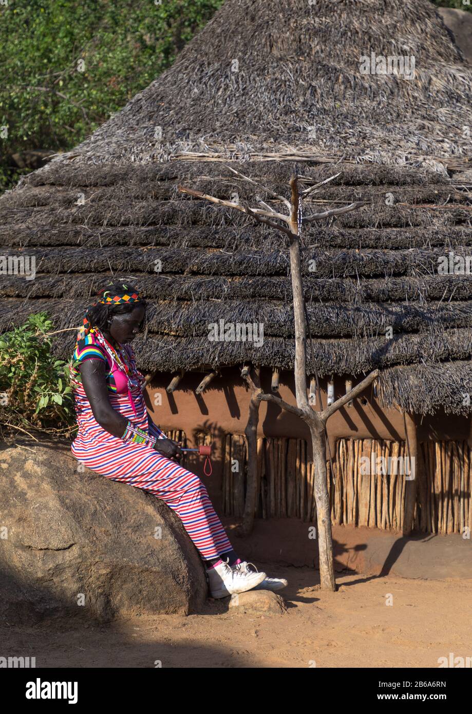 Larim tribe woman sit in front of her house, Boya Mountains, Imatong ...