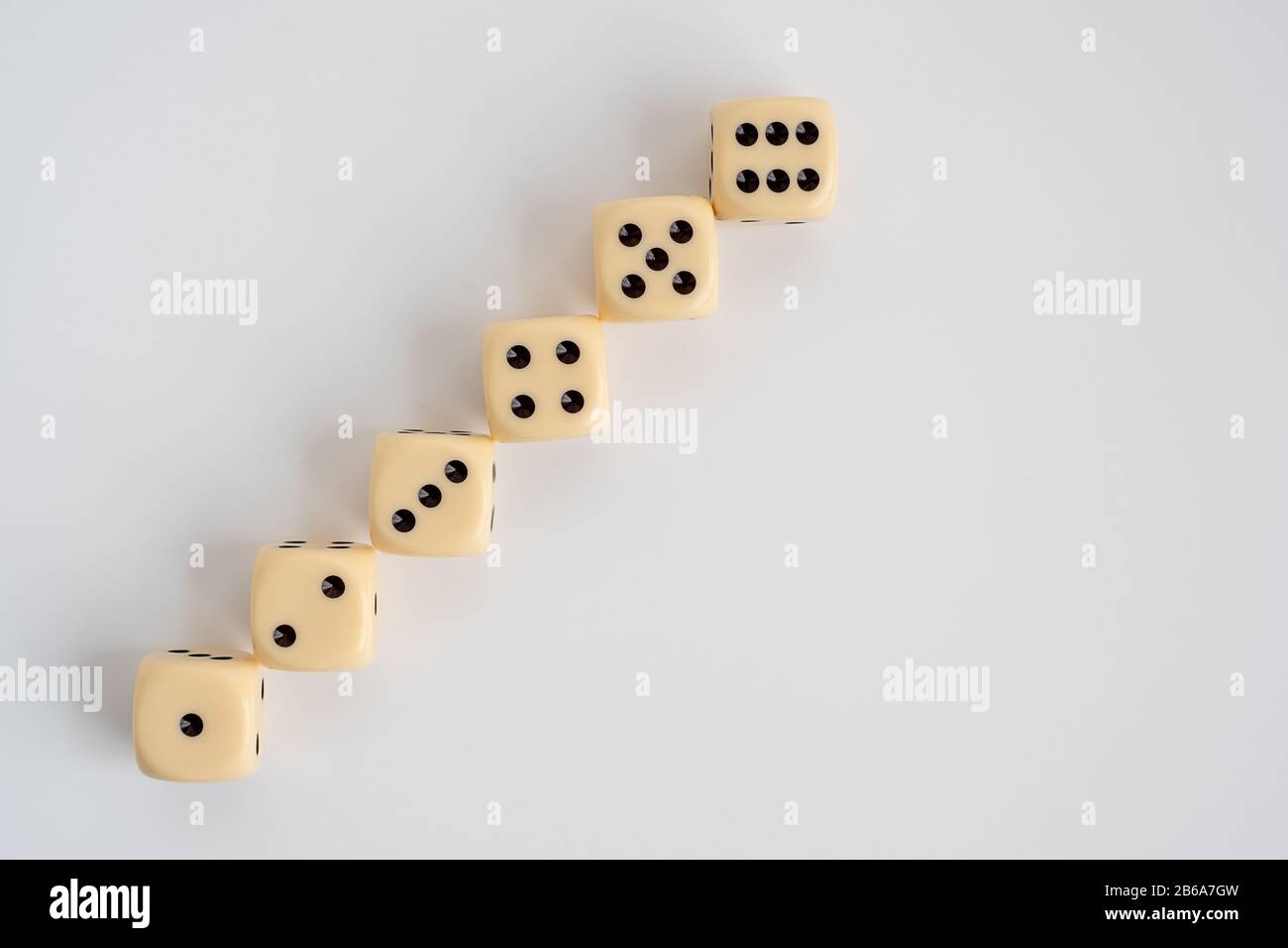 Six dice laid out in the form of a staircase, numbers from 1 to 6 ...