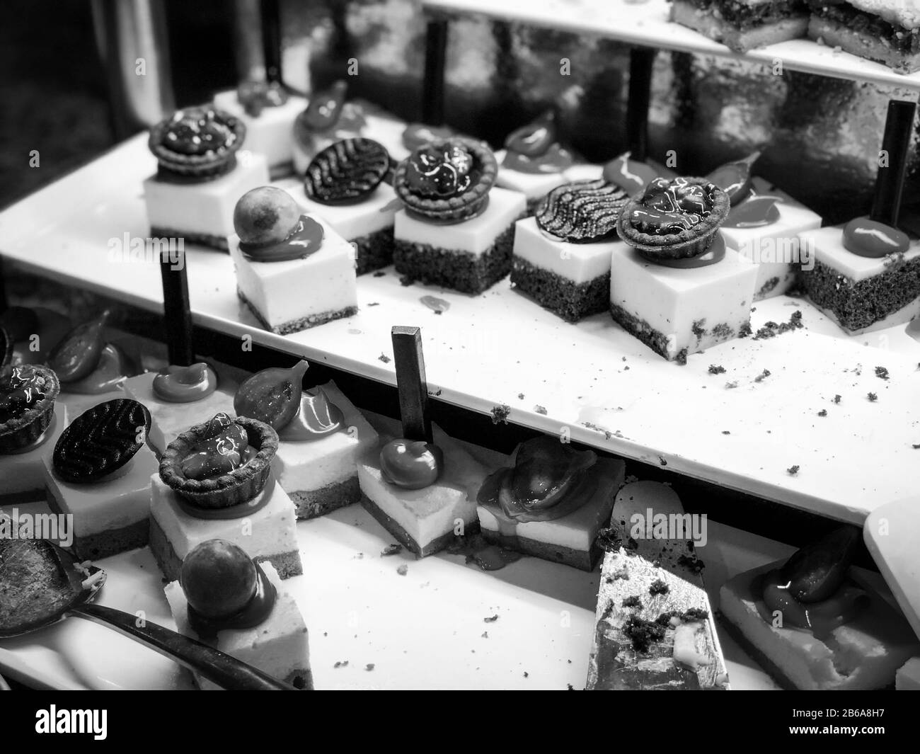 mix mini cakes & sweets with fresh fruits & glazed topping Stock Photo ...