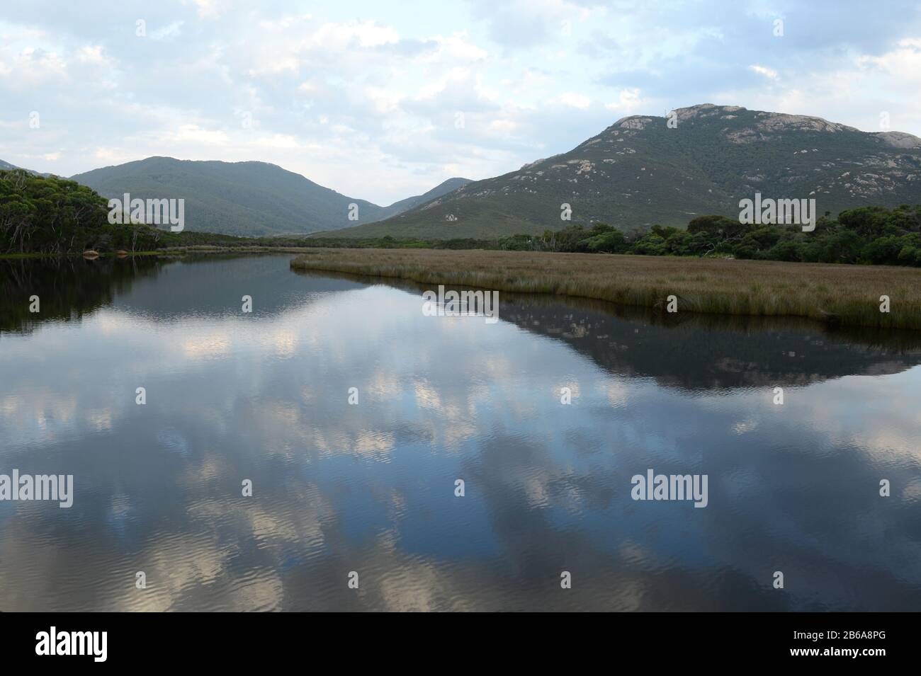 Early morning sky with Mt Ramsay (left) and Mt Mcalister reflected in ...