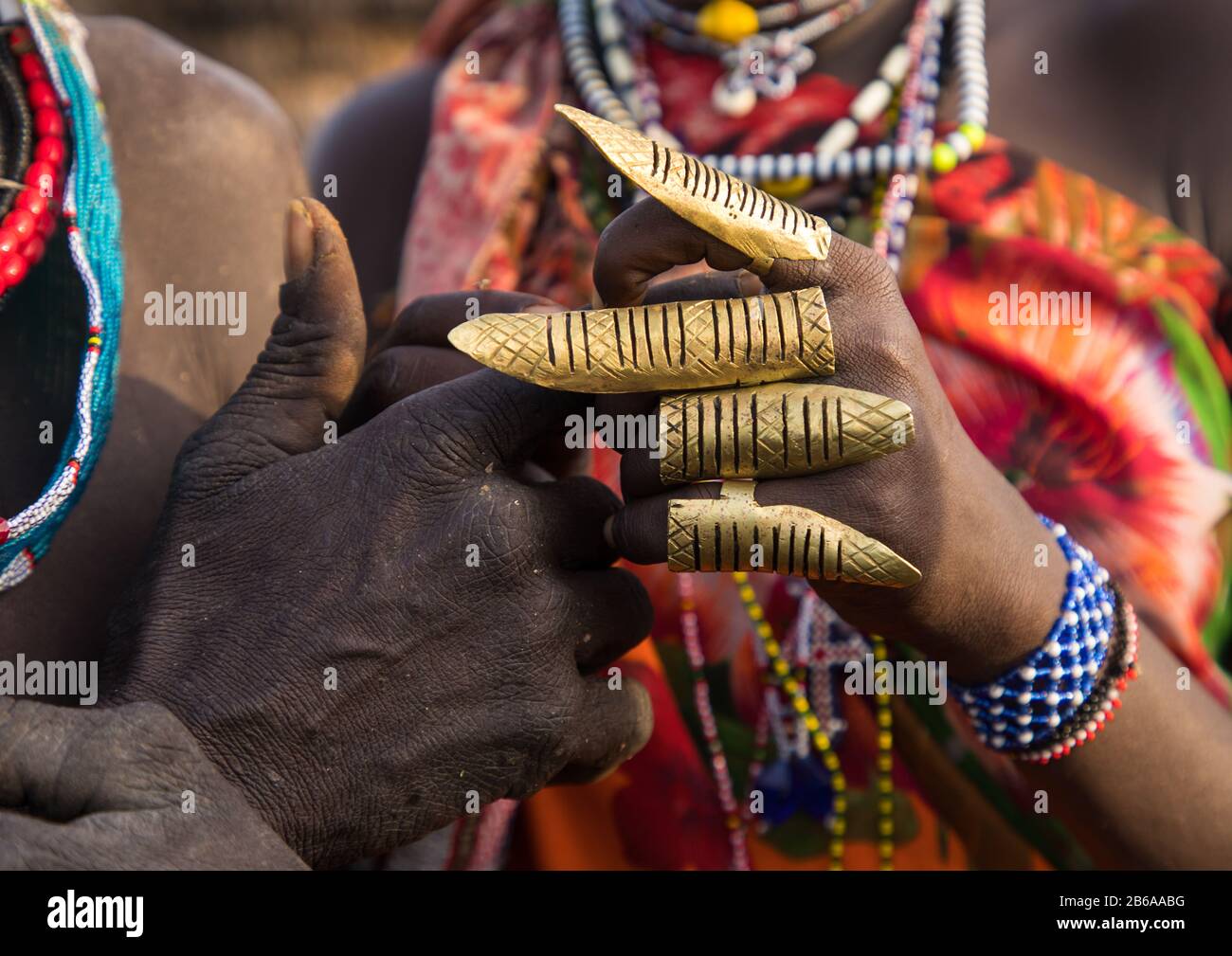 Toposa tribe huge rings on the fingers of a woman, Namorunyang State ...