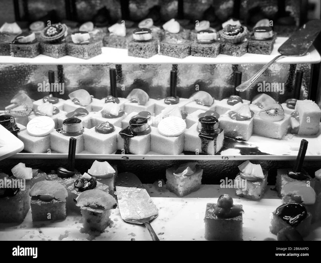 mix mini cakes & sweets with fresh fruits & glazed topping Stock Photo ...