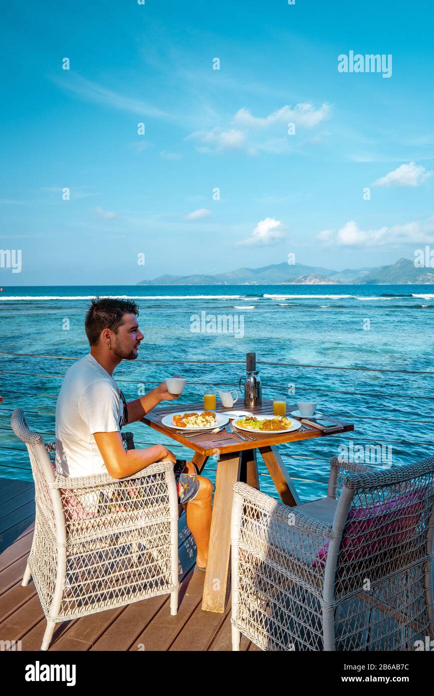 Indian man eating breakfast hi-res stock photography and images - Alamy