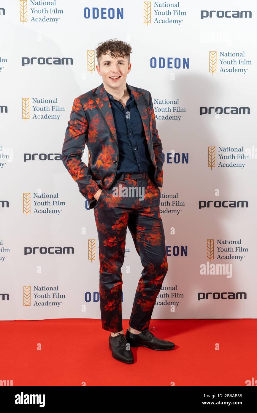 Jamie Carter posing for photos on the red carpet before attending the ...