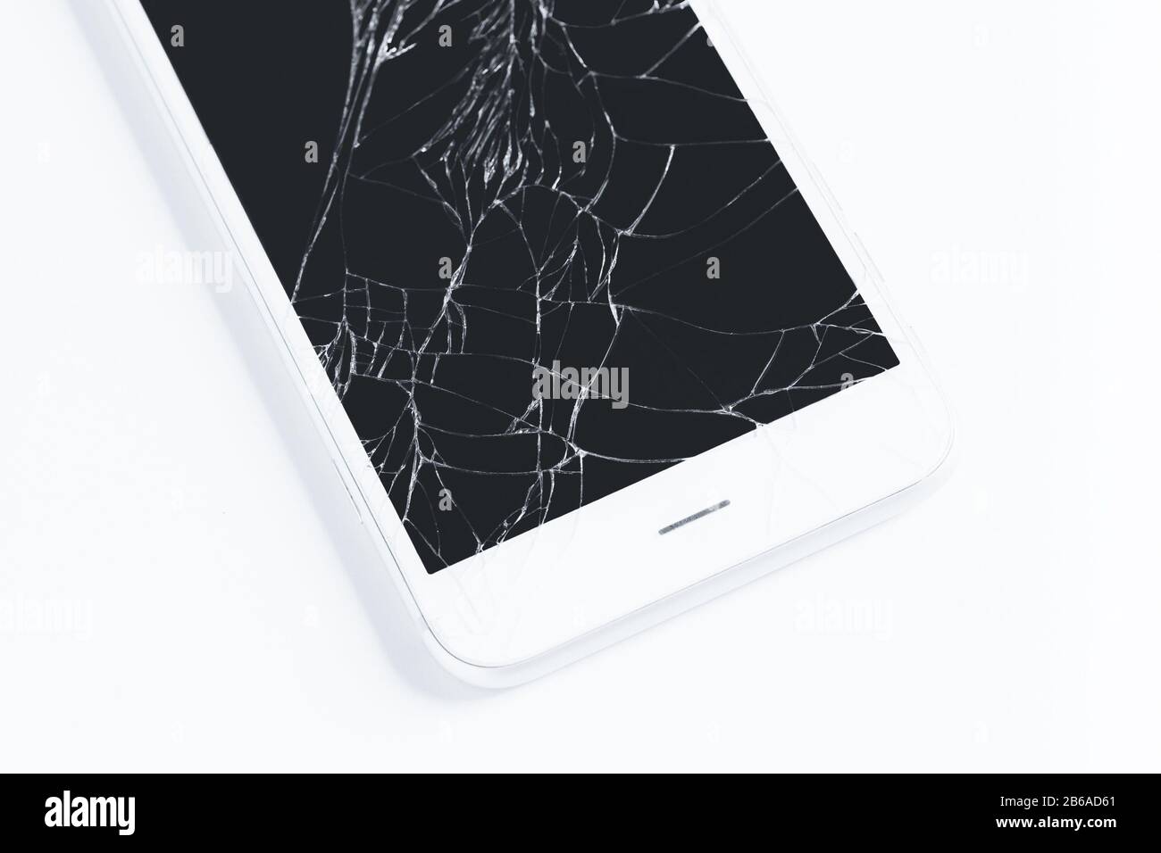 Mobile phone with a broken display on white background Stock Photo - Alamy