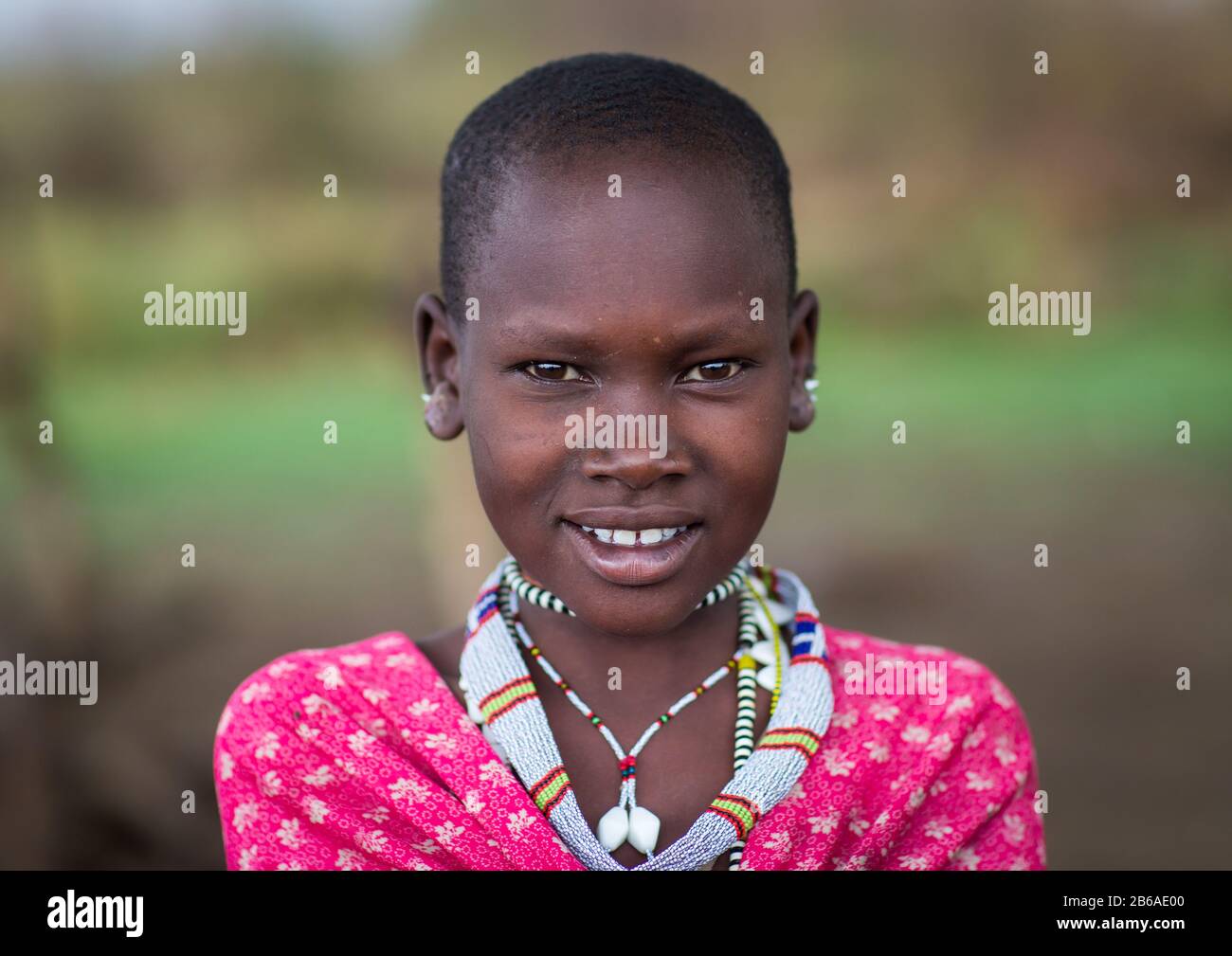 Portrait of a smiling Toposa girl, Namorunyang State, Kapoeta, South ...