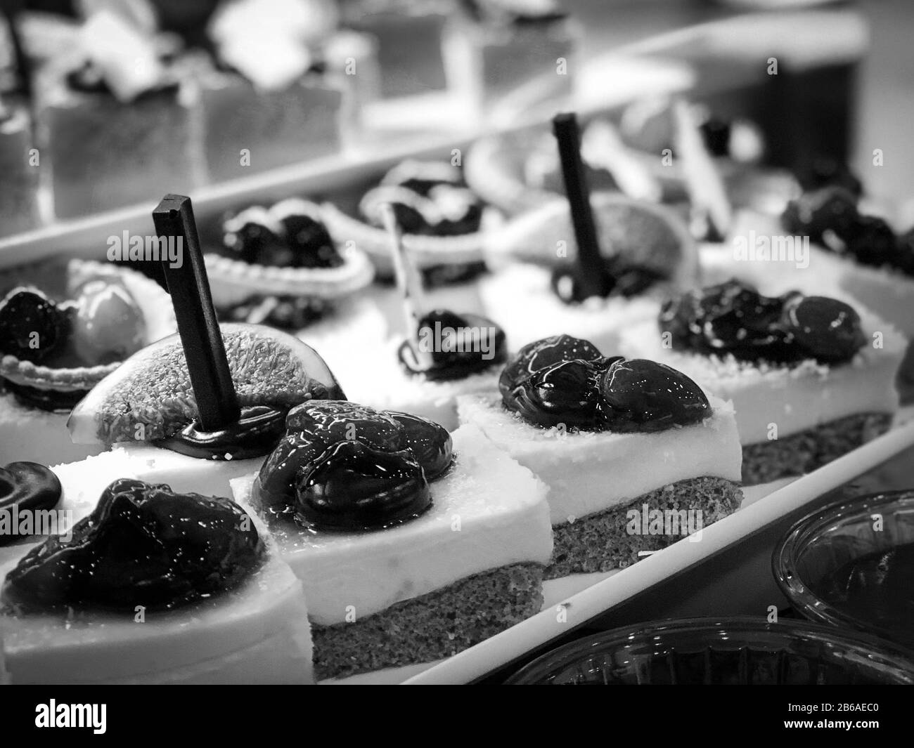 mix mini cakes & sweets with fresh fruits & glazed topping Stock Photo ...