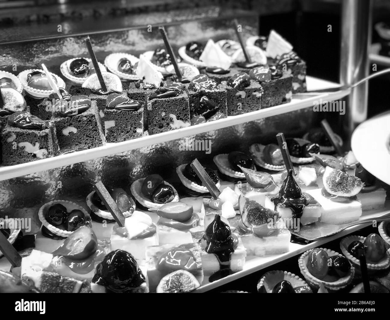 mix mini cakes & sweets with fresh fruits & glazed topping Stock Photo ...