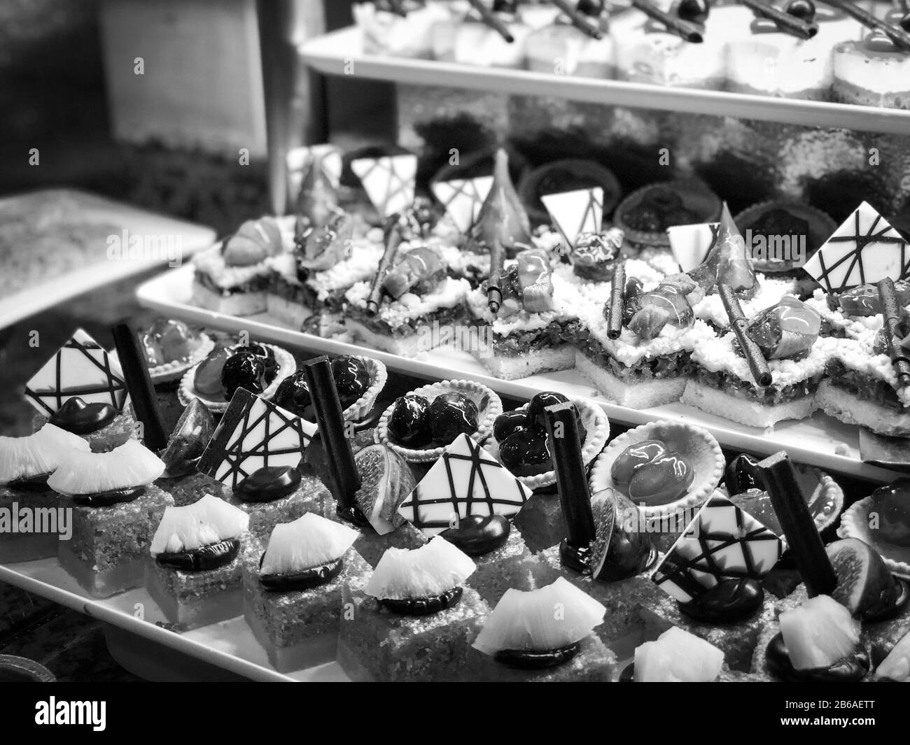 mix mini cakes & sweets with fresh fruits & glazed topping Stock Photo ...