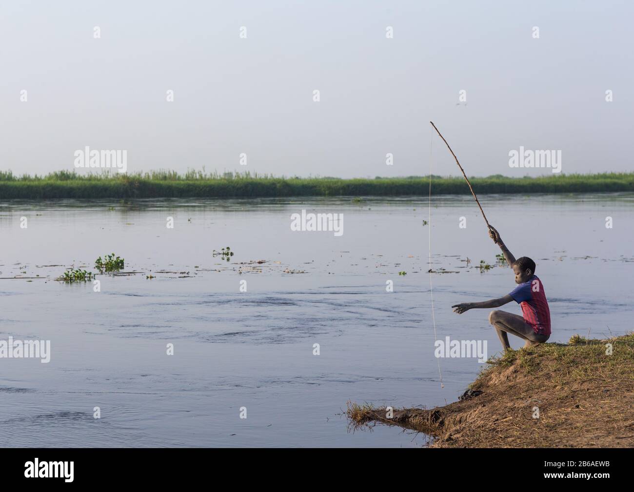 Boy africa fish hi-res stock photography and images - Alamy