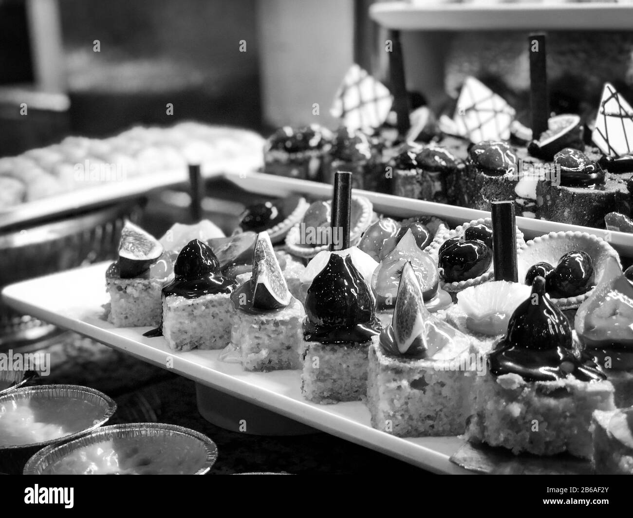 mix mini cakes & sweets with fresh fruits & glazed topping Stock Photo ...