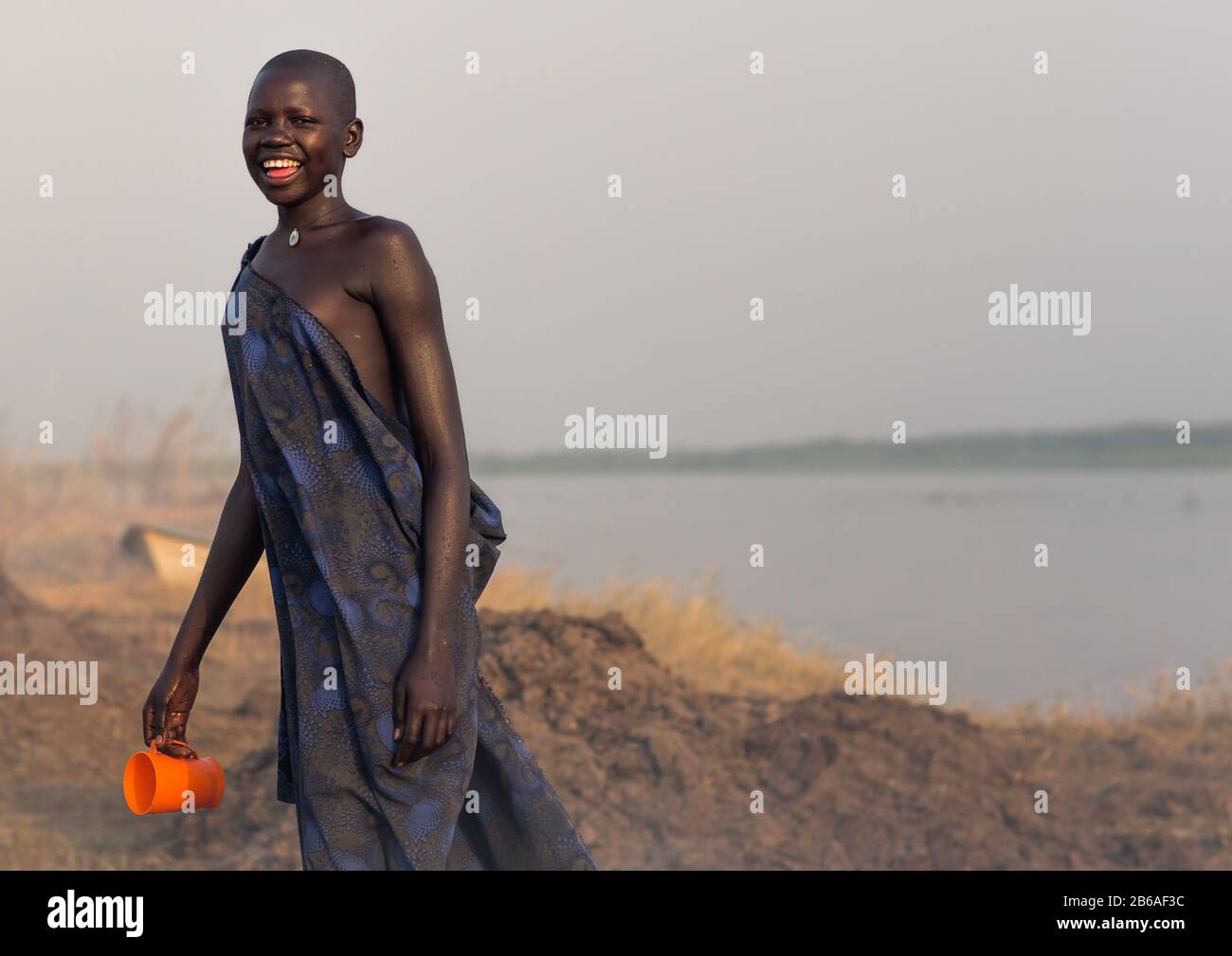 Portrait of a Mundari tribe woman in front of the river Nile, Central Equatoria, Terekeka, South ...
