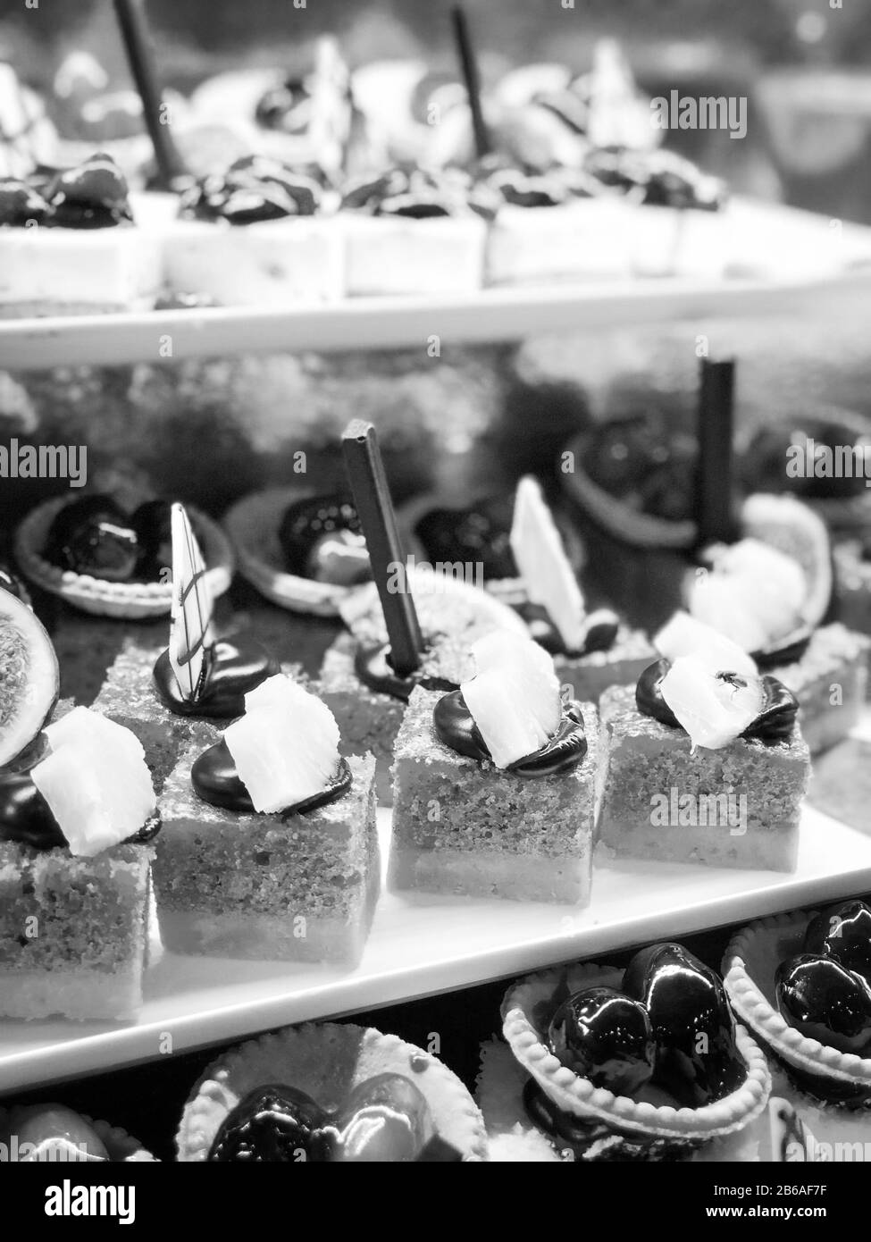 mix mini cakes & sweets with fresh fruits & glazed topping Stock Photo ...