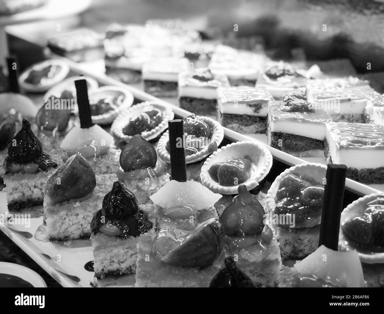 mix mini cakes & sweets with fresh fruits & glazed topping Stock Photo ...