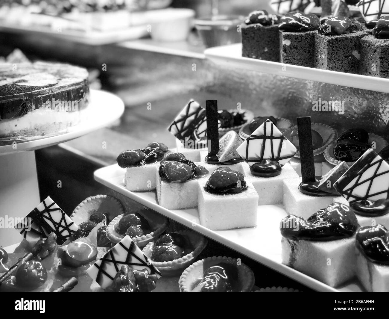 mix mini cakes & sweets with fresh fruits & glazed topping Stock Photo ...