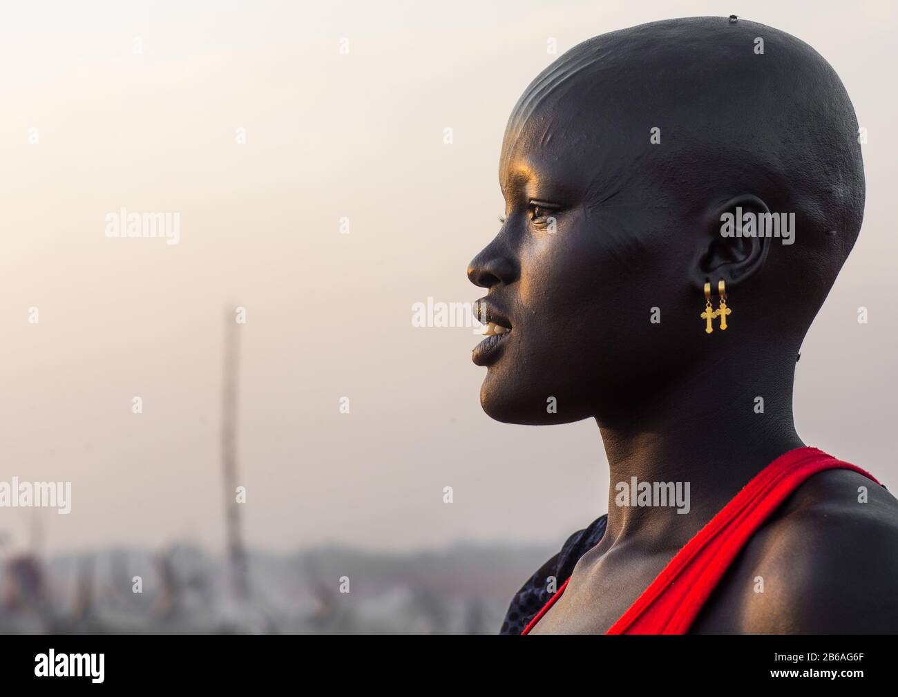 Portrait of a Mundari tribe woman with scarifications and bald head, Central Equatoria, Terekeka ...