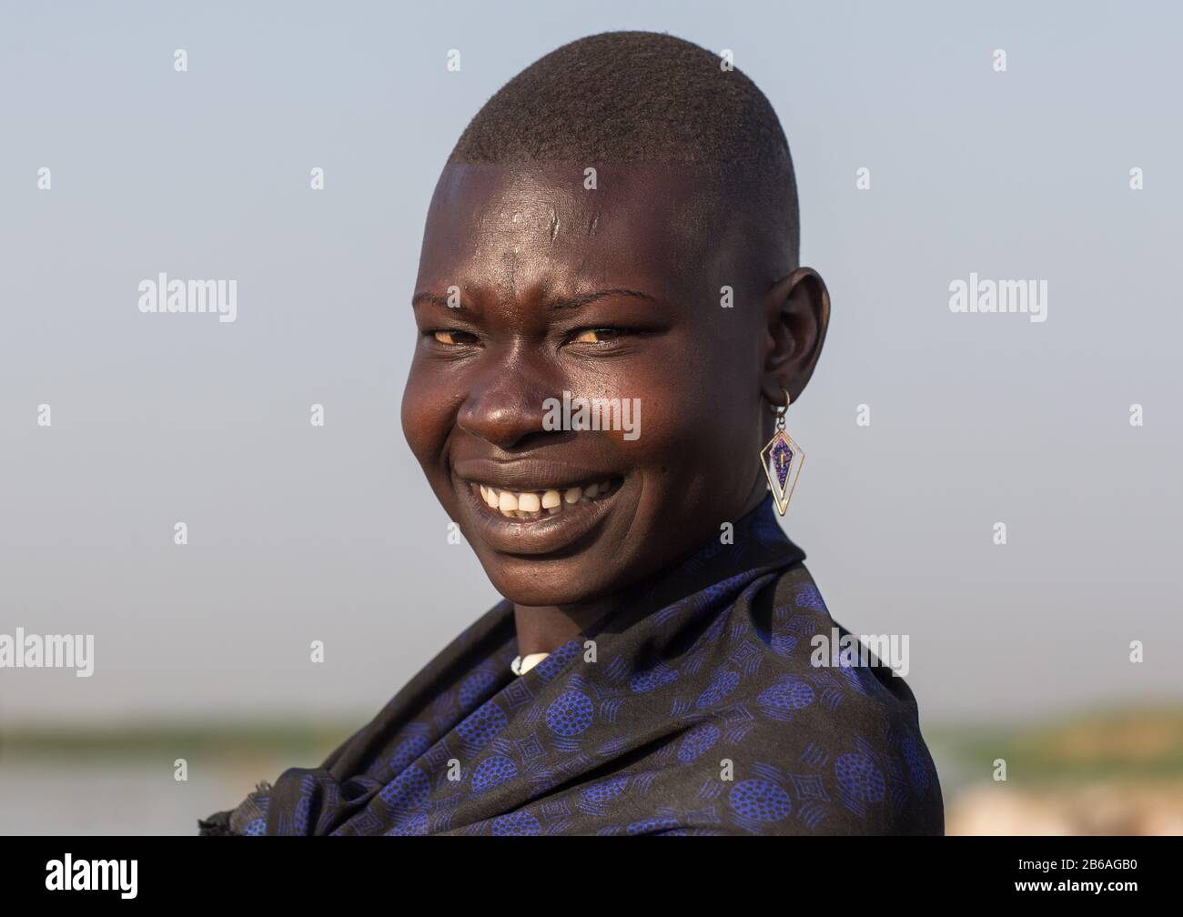 Portrait of a smiling Mundari tribe woman, Central Equatoria, Terekeka, South Sudan Stock Photo ...