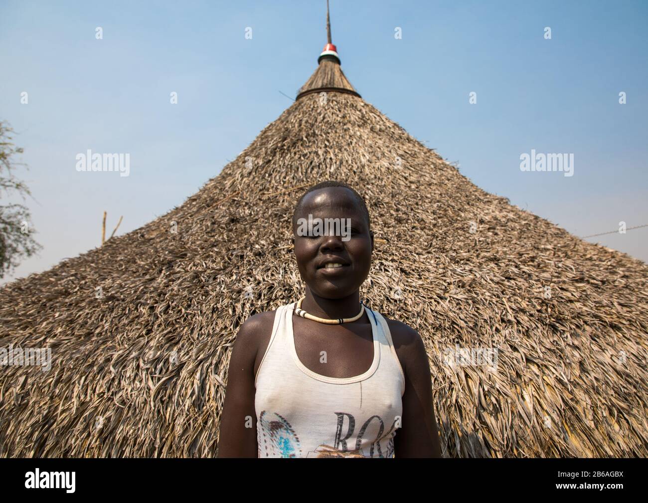 Portrait of a Mundari tribe woman in front of her hut, Central Equatoria, Terekeka, South Sudan ...