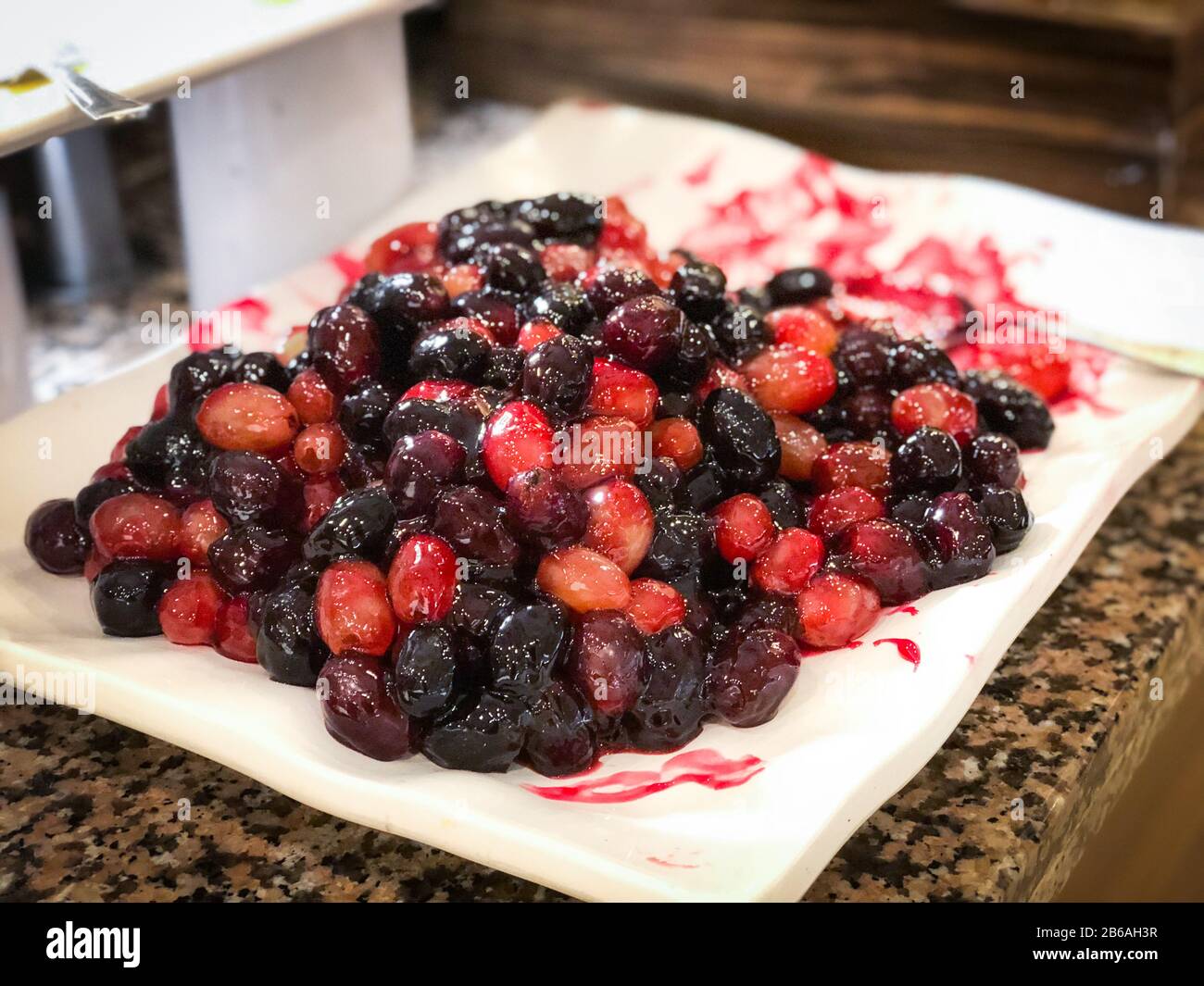 mix mini cakes & sweets with fresh fruits & glazed topping Stock Photo ...