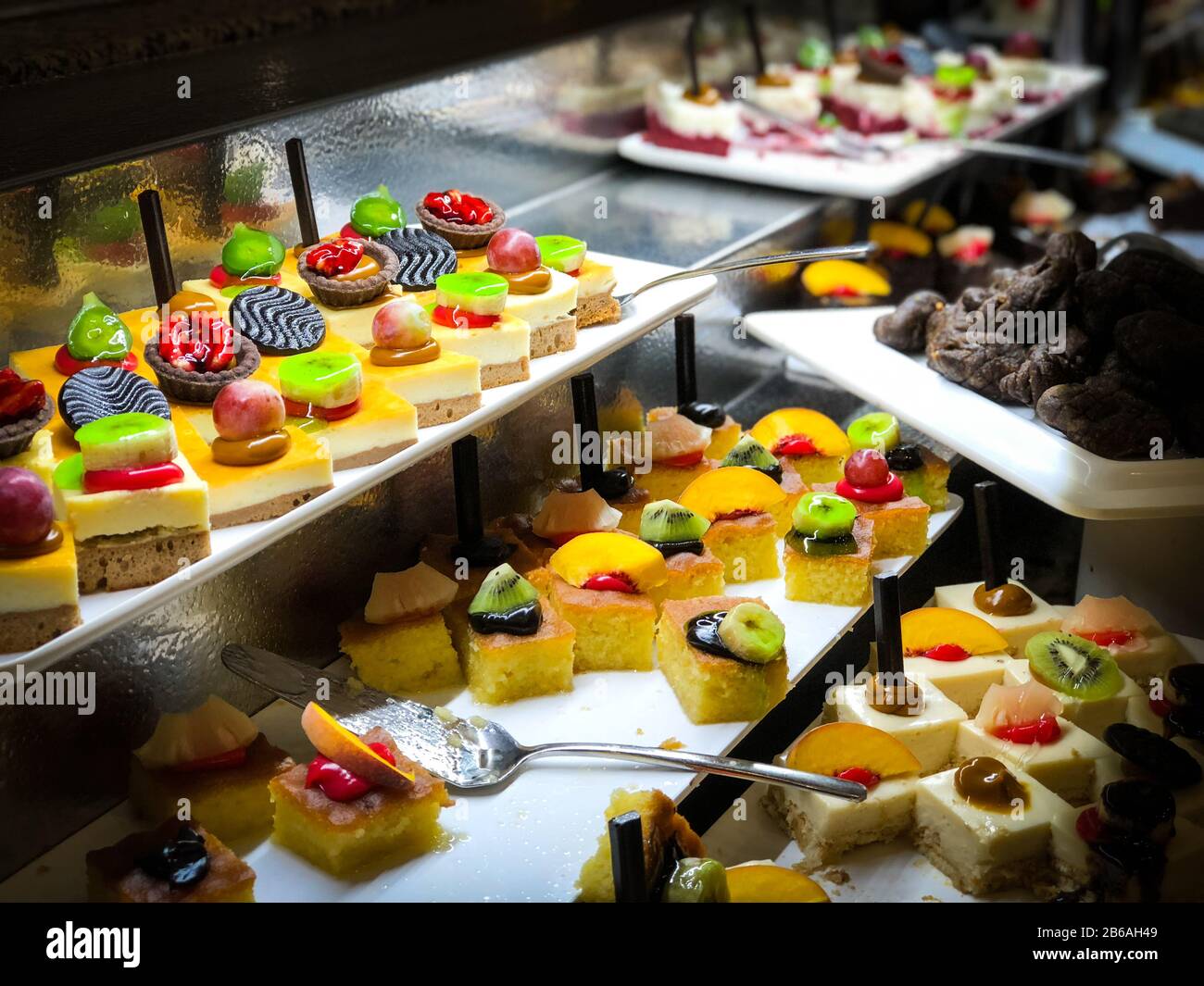 mix mini cakes & sweets with fresh fruits & glazed topping Stock Photo ...