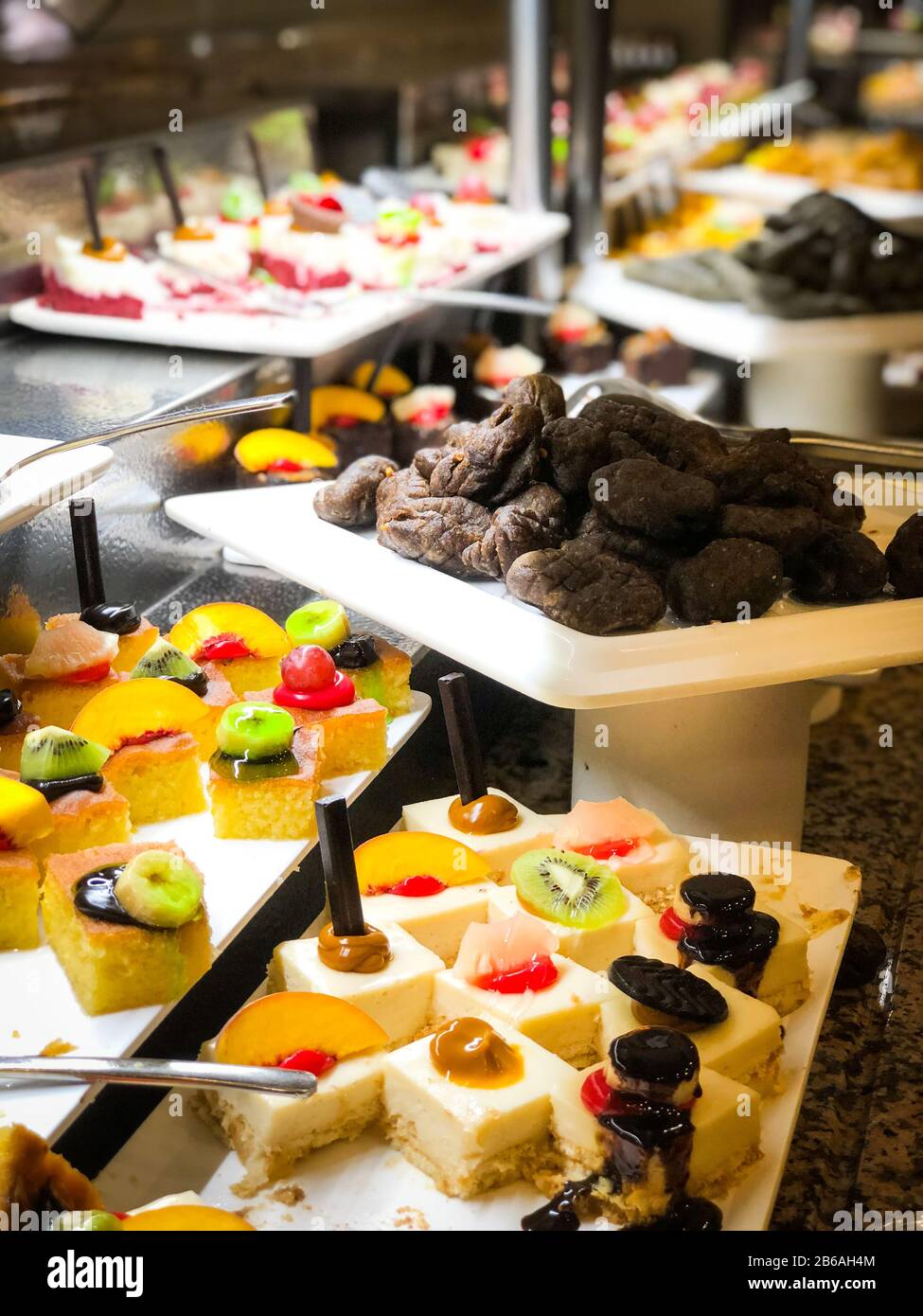 mix mini cakes & sweets with fresh fruits & glazed topping Stock Photo ...